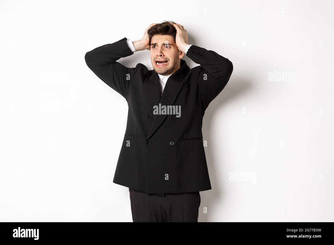 Image of anxious businessman start to panic, looking left with worried ...