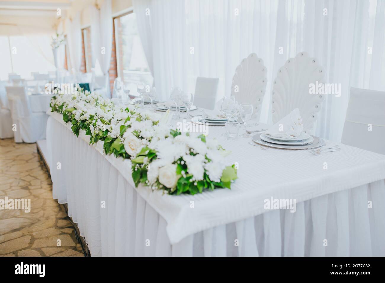 Beautiful table setup in a hall for a wedding ceremony Stock Photo - Alamy