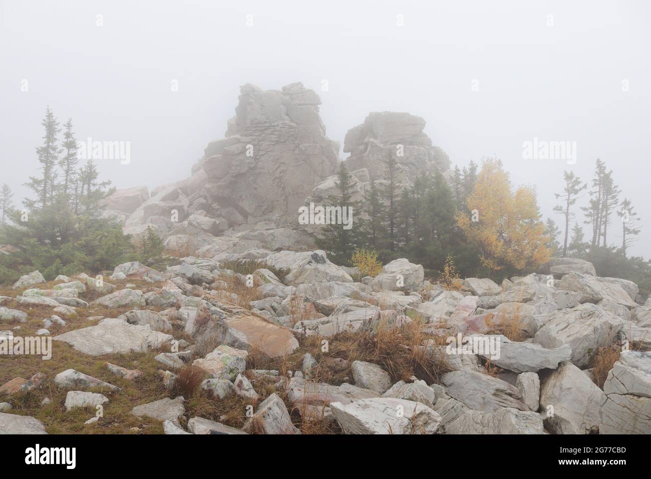Rocky and dangerous terrain on a foggy day Stock Photo - Alamy