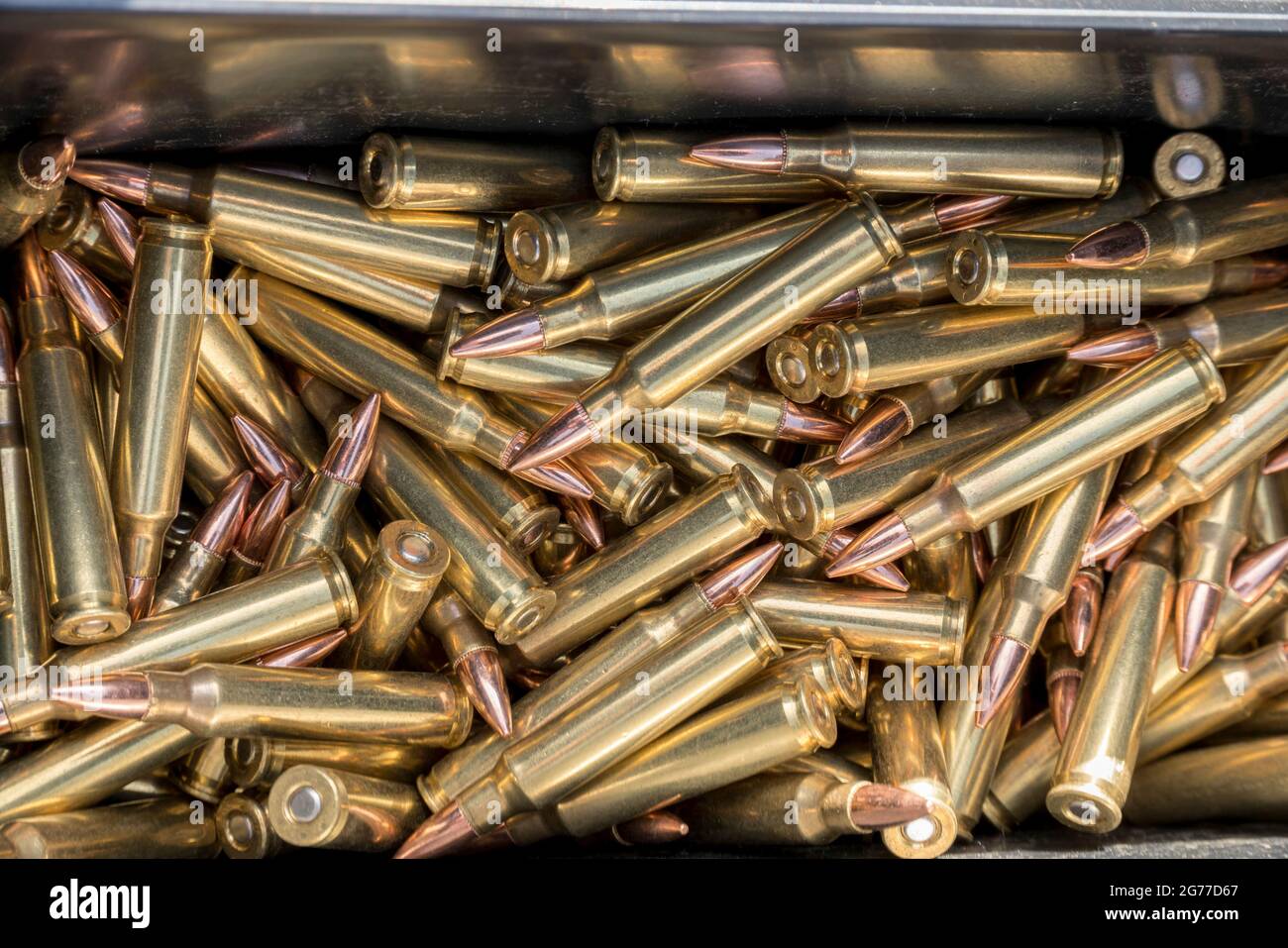 A pile of copper bullets of a gun used in shooting activity Stock Photo ...