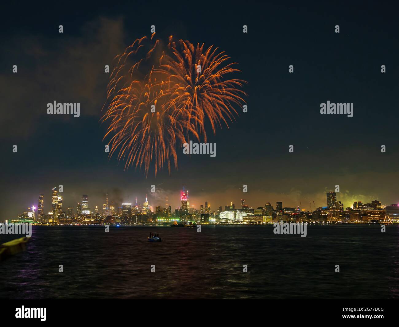 Fireworks celebration of July 4th with the famous Manhattan skyline at ...