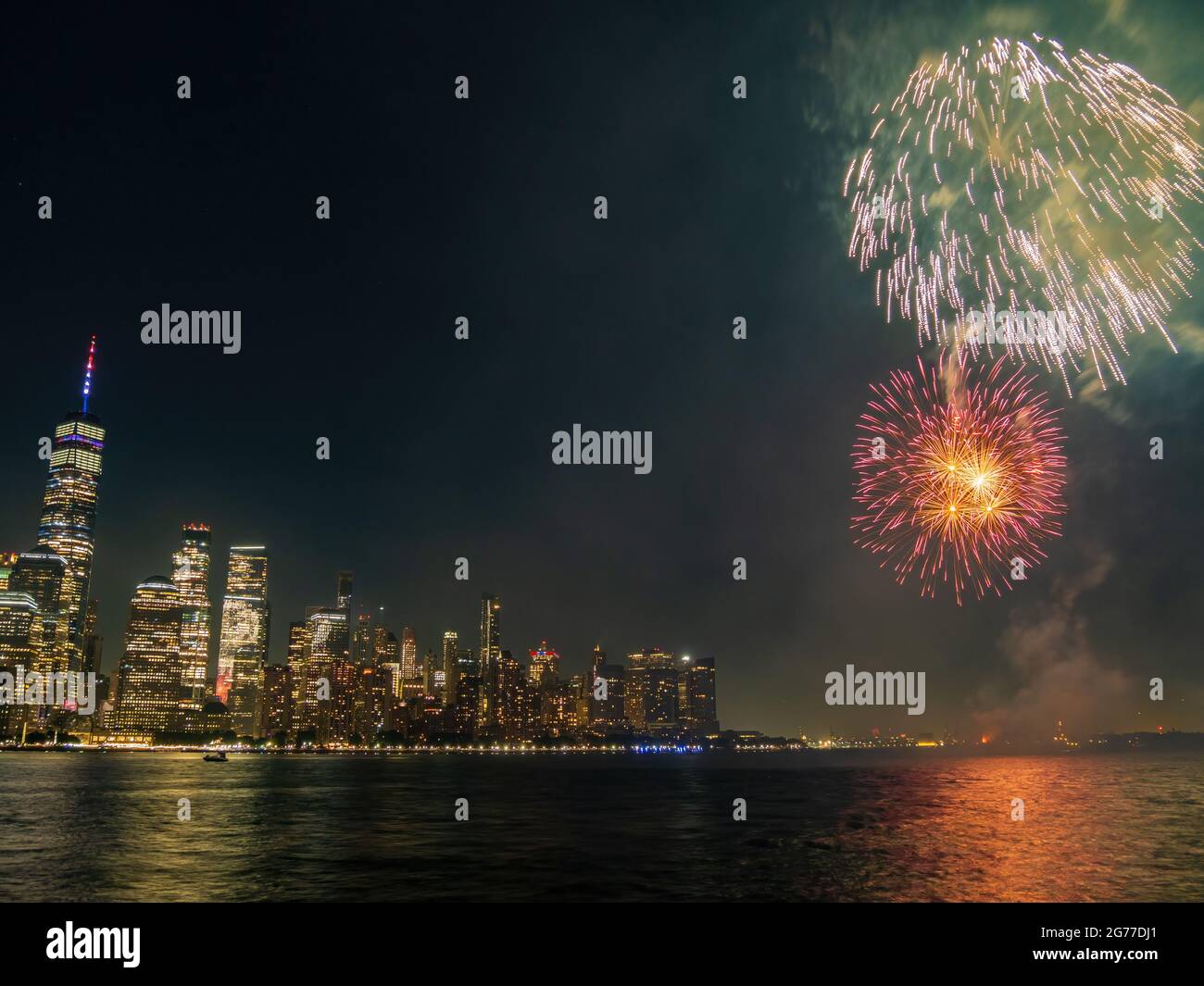Fireworks celebration of July 4th with the famous Manhattan skyline at ...