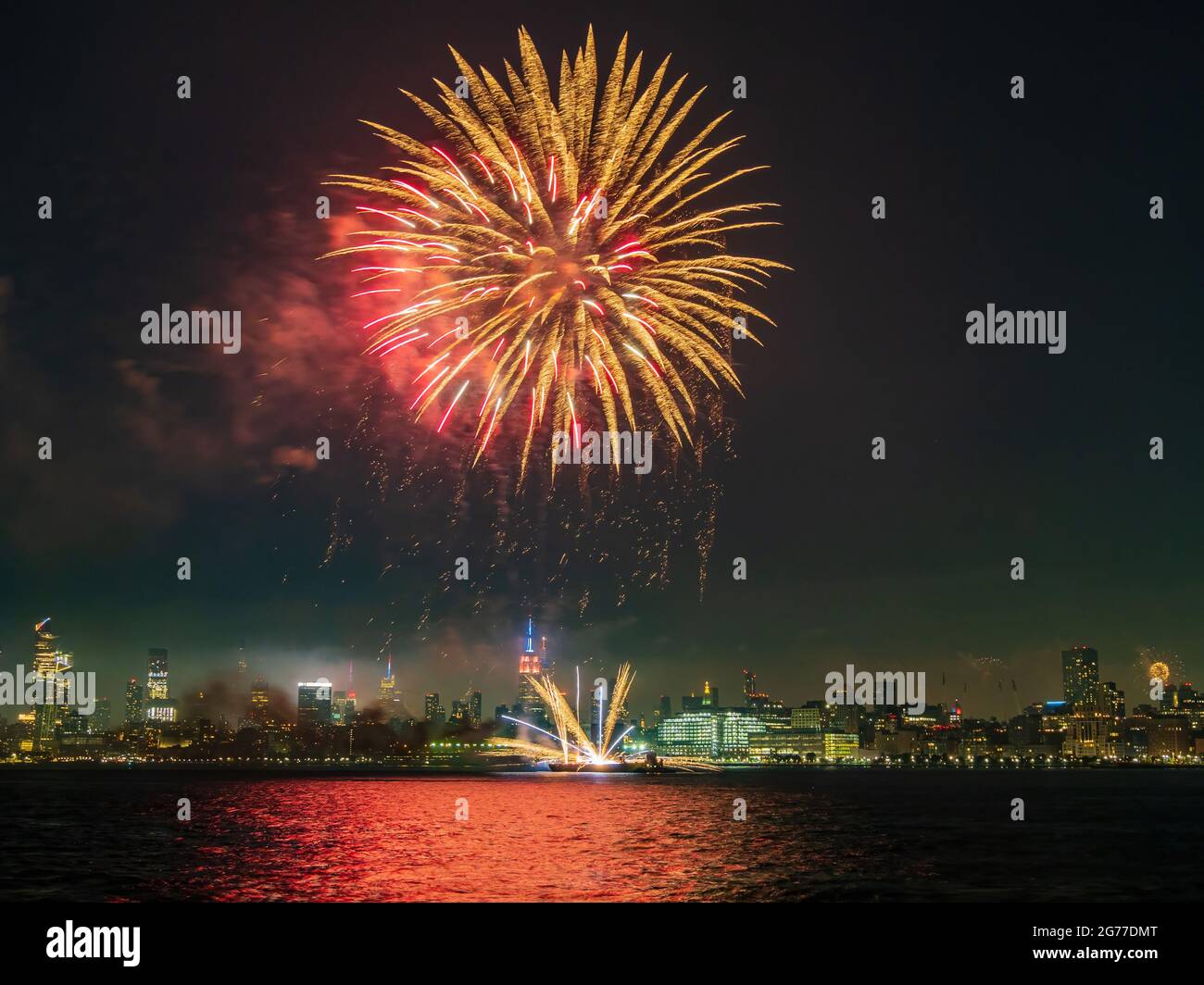 Fireworks celebration of July 4th with the famous Manhattan skyline at ...