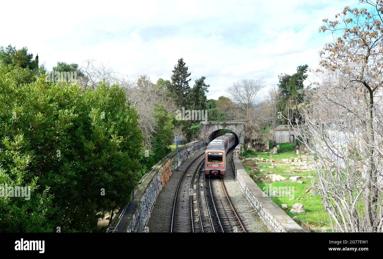 A Greek train passing by the Ancient Agora of Athens, Greece Stock ...