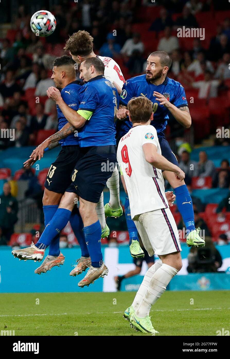 London, Britain. 11th July, 2021. England's John Stones (top) competes ...