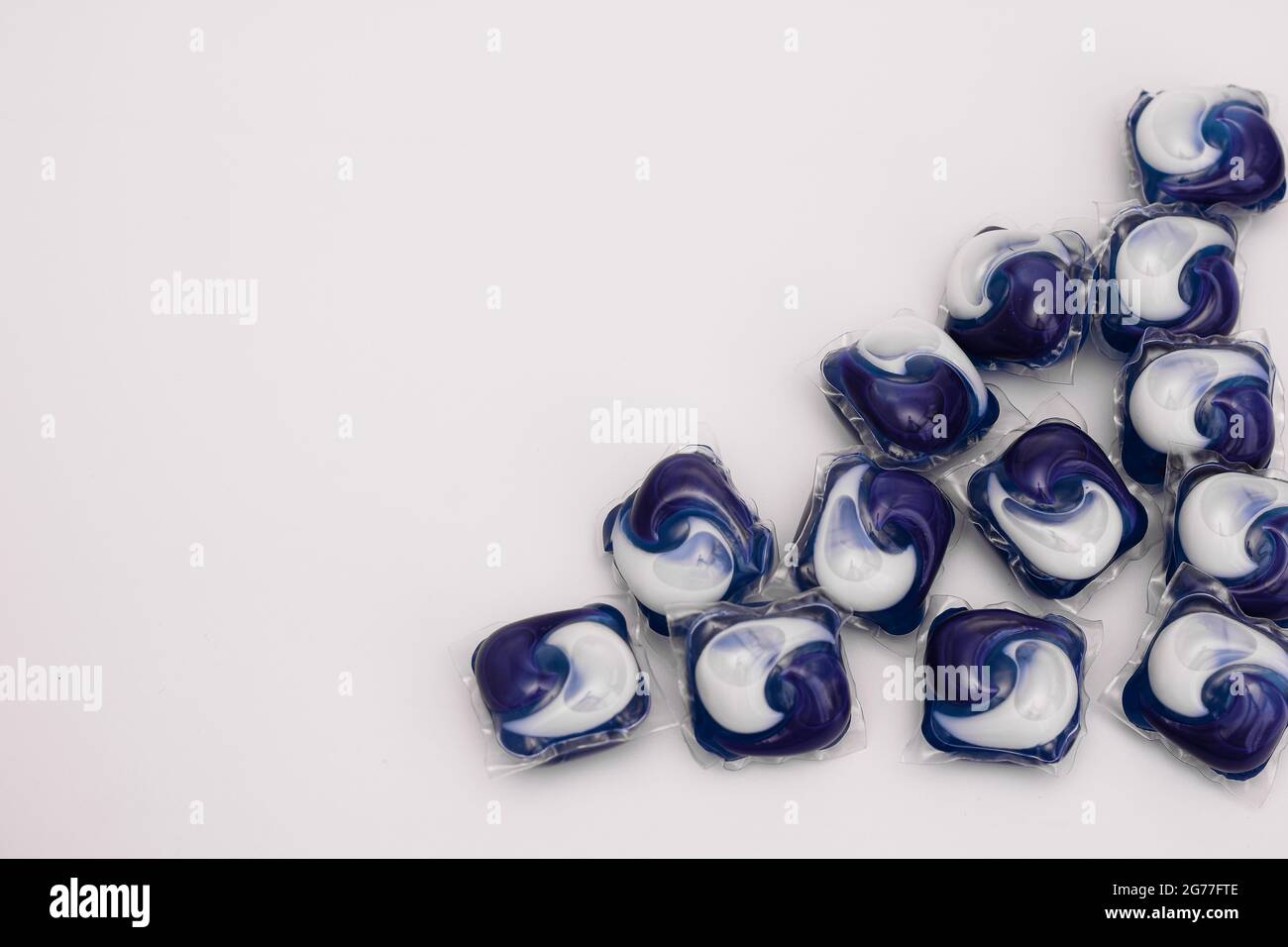 a group of blue gel capsules of washing powder Stock Photo - Alamy