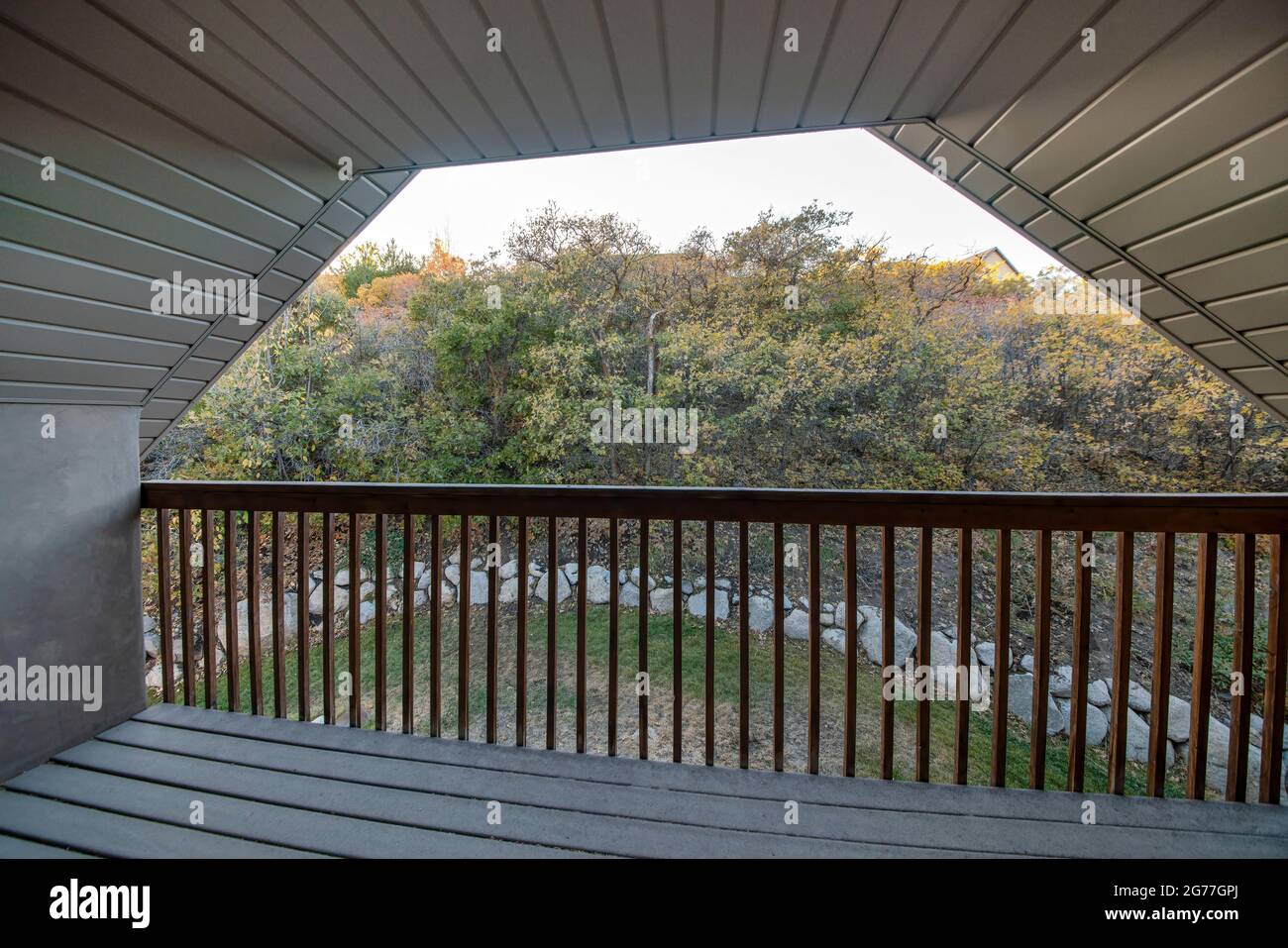 Terrace with a wood planks flooring and a beadboard white ceiling of a ...