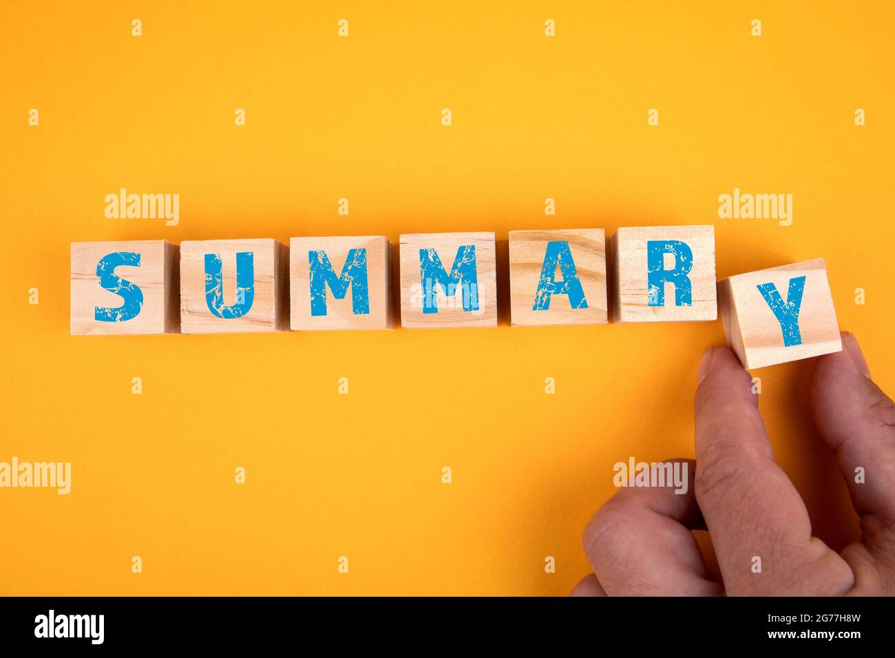 SUMMARY concept. Wooden blocks with letters on a yellow background ...