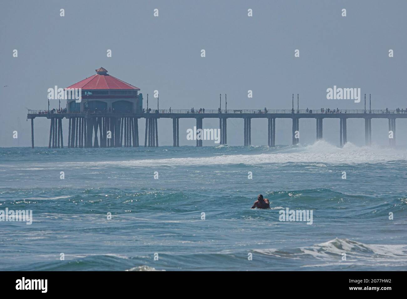 The iconic Huntington Pier in Huntington Beach California has been in ...