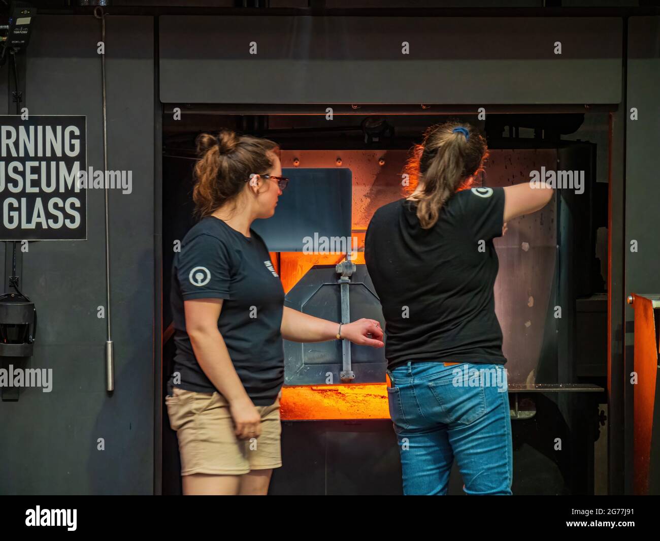 New York, JUL 6, 2021 - Woman working on making glass in the Corning ...