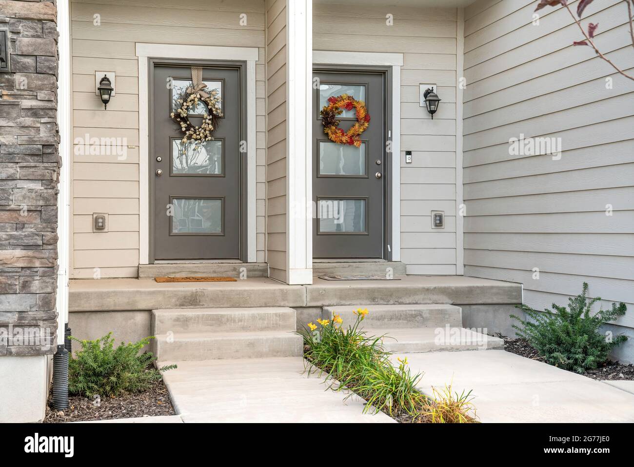 Exterior of a two front door with wall divider in the middle Stock ...