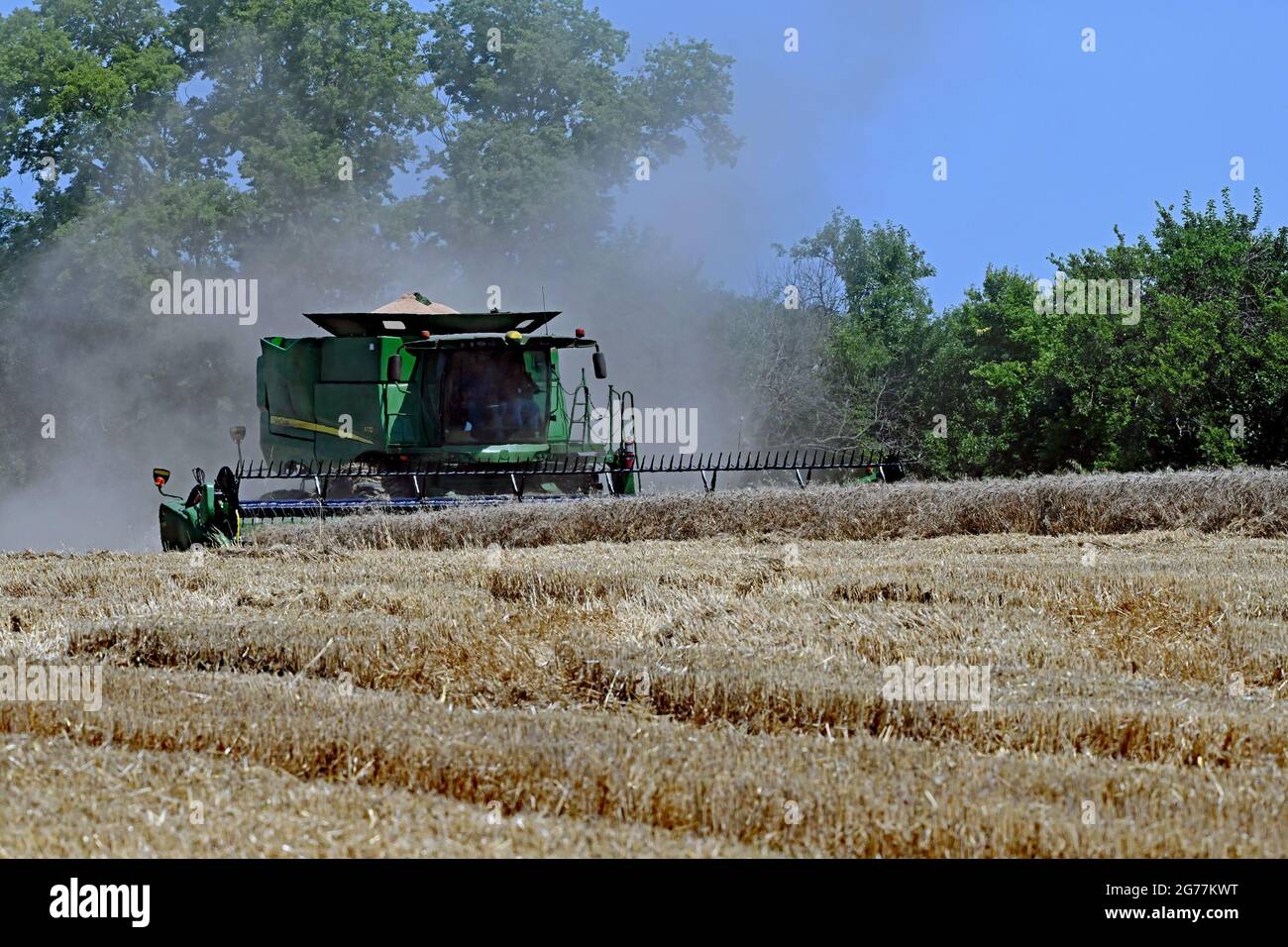 An S770 John Deere combine with a 735FD cutter header attached in the ...