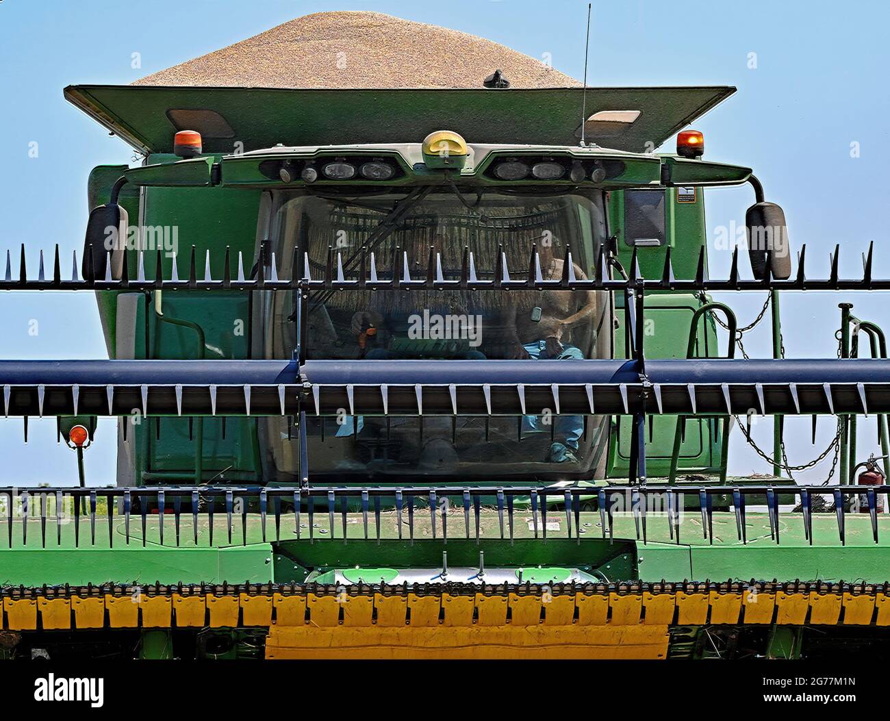 With it’s hopper full of 300 bushels of winter wheat a S770 John Deere ...