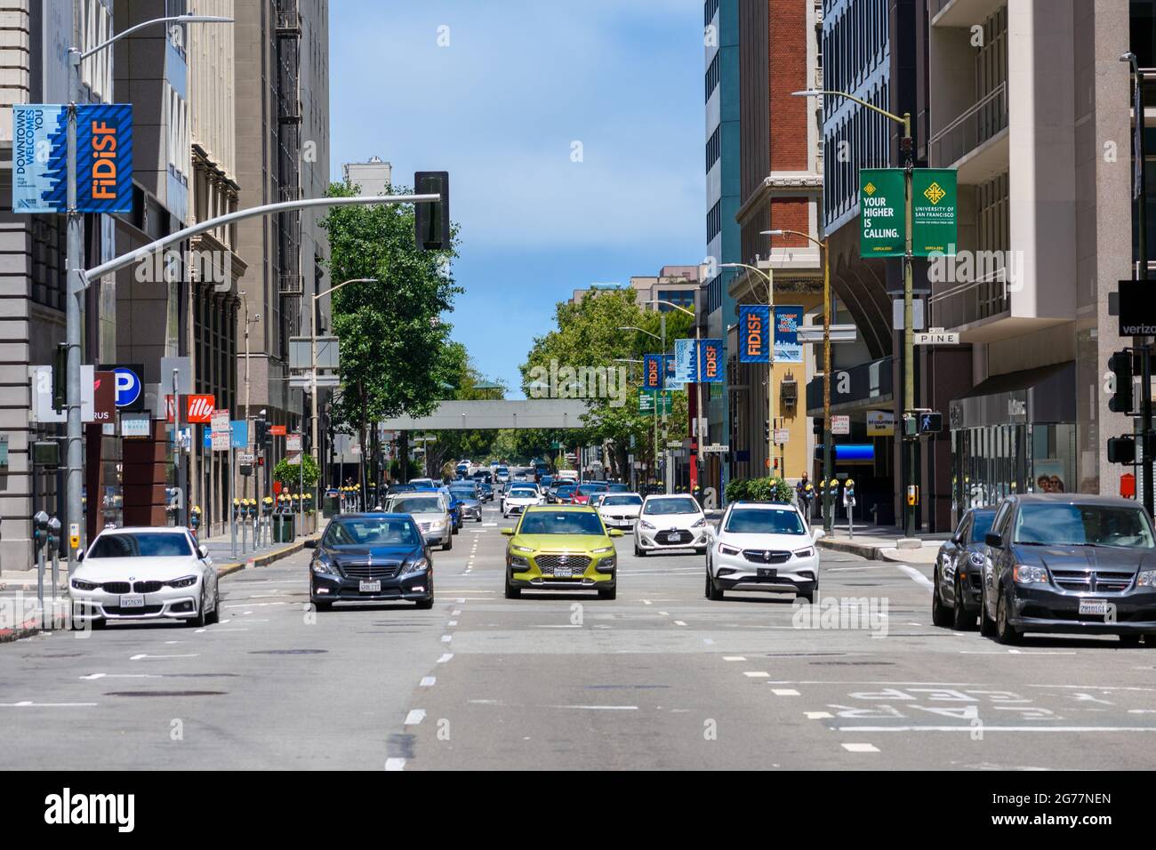 Front view of passenger cars driving toward a pedestrian crosswalk on ...