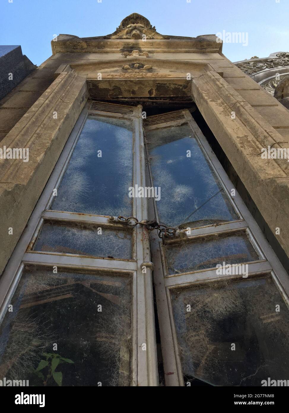 Vertical low angle shot of the old door of an abandoned building Stock ...
