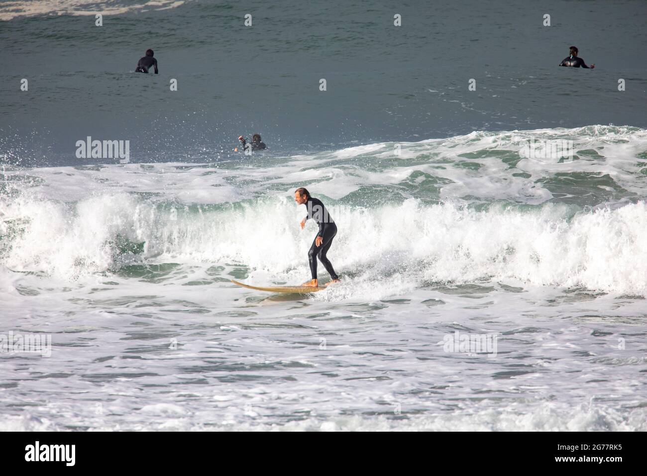Australian surfers in the ocean off Palm Beach in Sydney,NSW,Australia ...