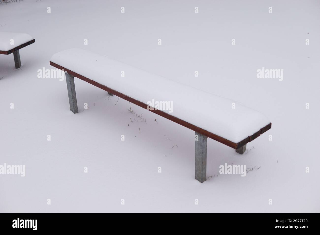 Shot of park benches covered with snow in winter Stock Photo - Alamy