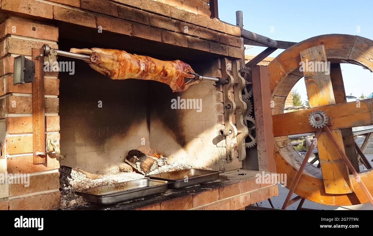Spit Roasted Lambs, traditional way of roasting lambs on a rotisserie ...