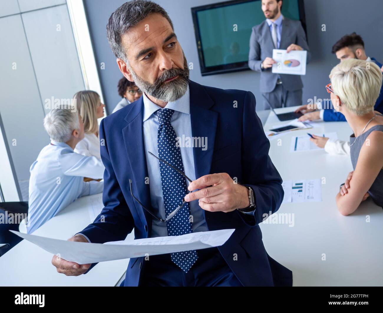 Handsome mature businessman, leader working in the office Stock Photo ...