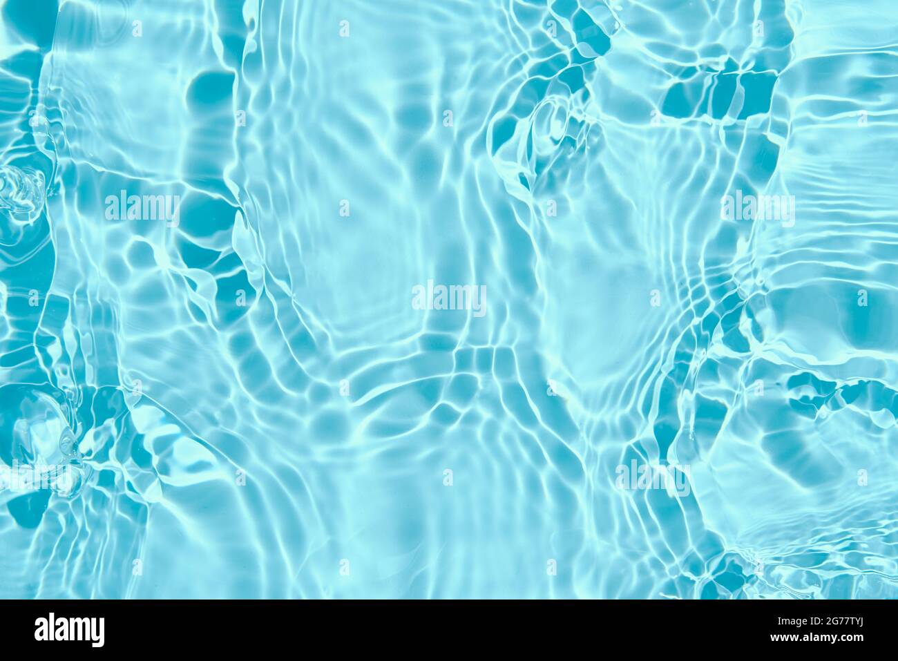 Blue water surface background. Water texture with splashes and bubbles ...