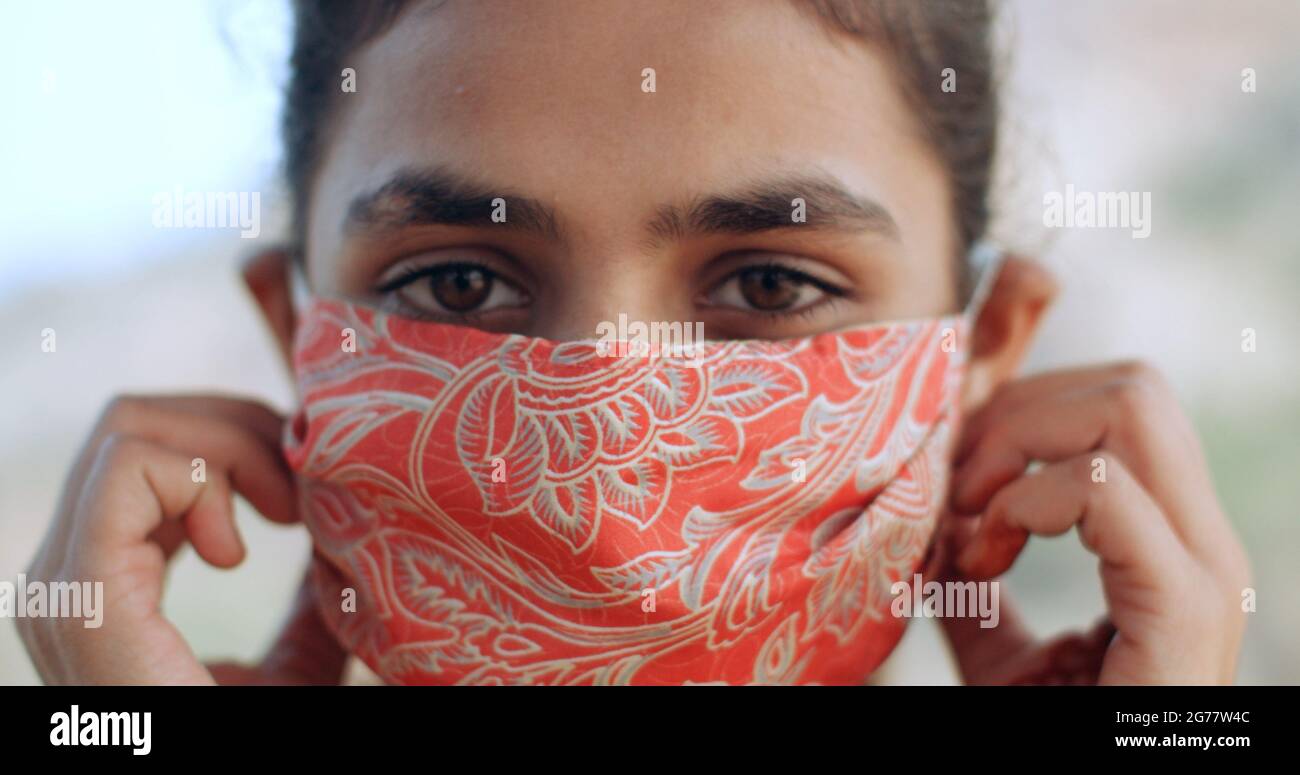 Shallow focus of an Indian girl wearing a face mask- new normal concept Stock Photo - Alamy