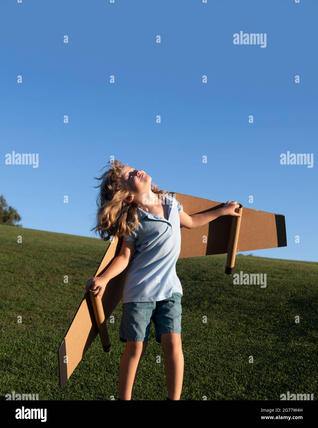 Funny child playing with toy jetpack. Child pilot astronaut or spaceman ...