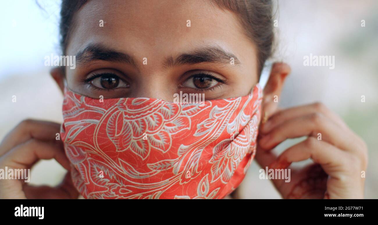 Closeup shot of an Indian girl wearing a mask- new normal concept Stock Photo - Alamy