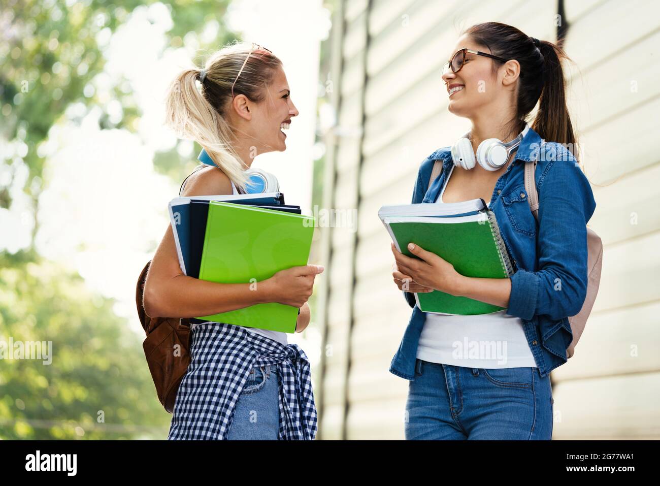 Group of happy university students studying together and having fun ...