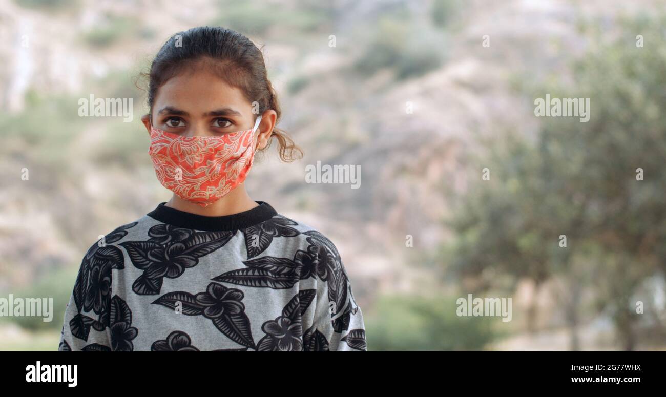 Closeup shot of an Indian girl wearing a mask- new normal concept Stock Photo - Alamy