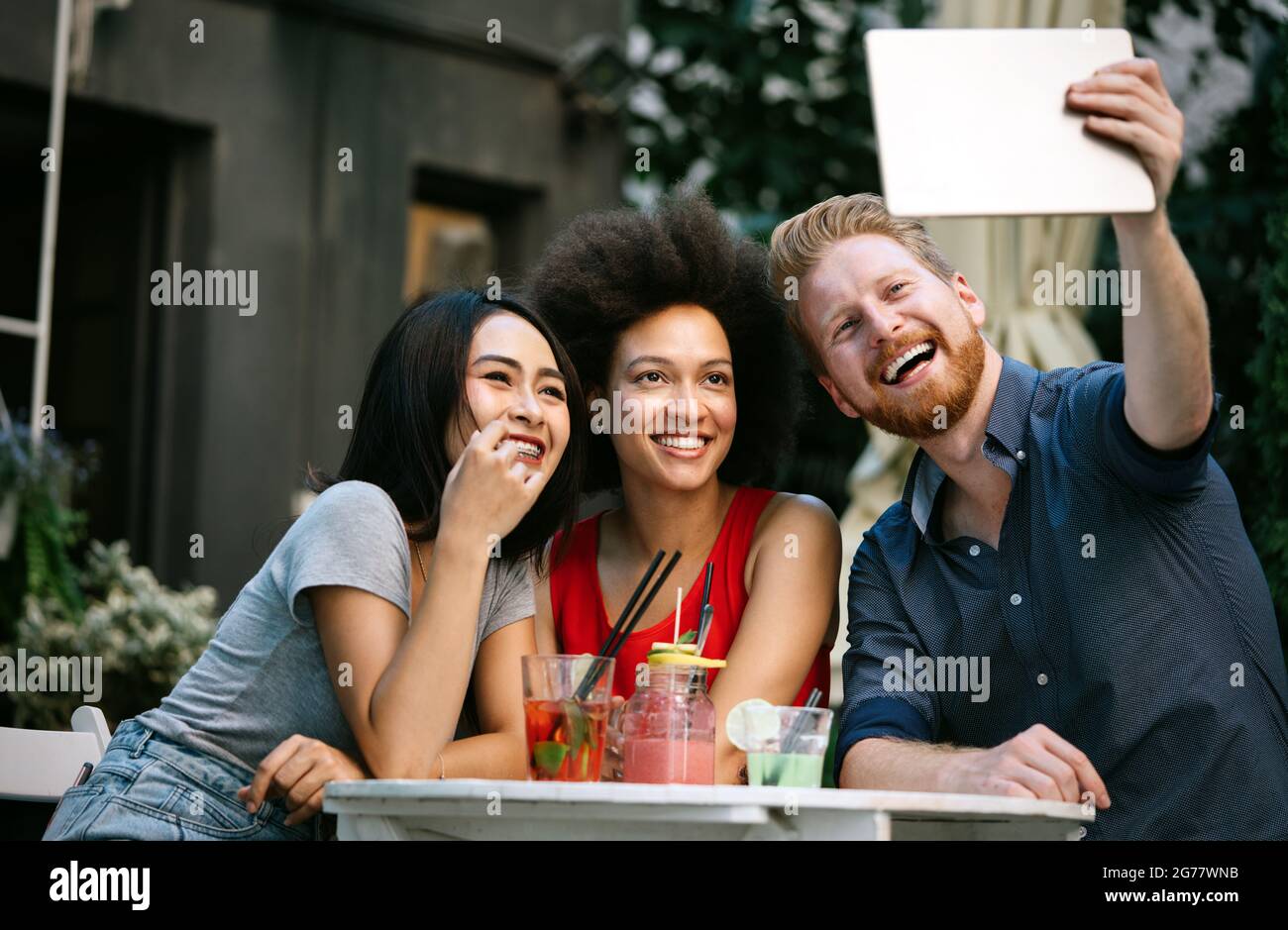 Group of friends having fun together. People talking laughing and ...