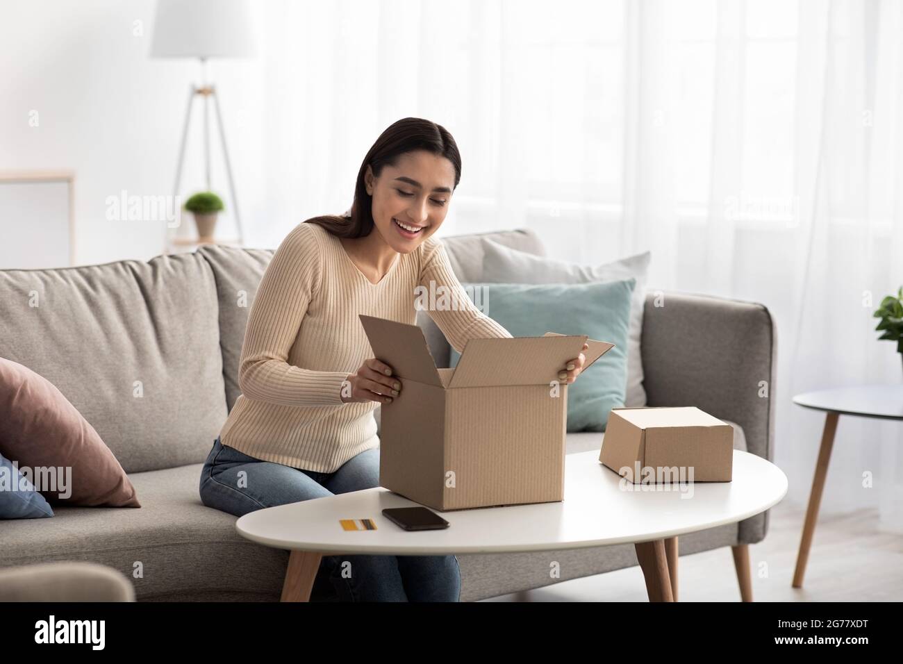 Customer receive good parcel open cardboard box at home satisfied with ...