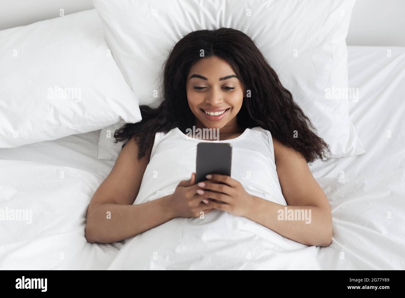 Woman searching under bed hi-res stock photography and images - Alamy