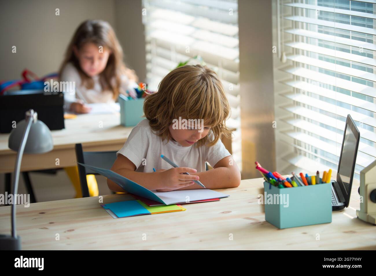 Schoolkids studying homework math during lesson at classroom, education ...