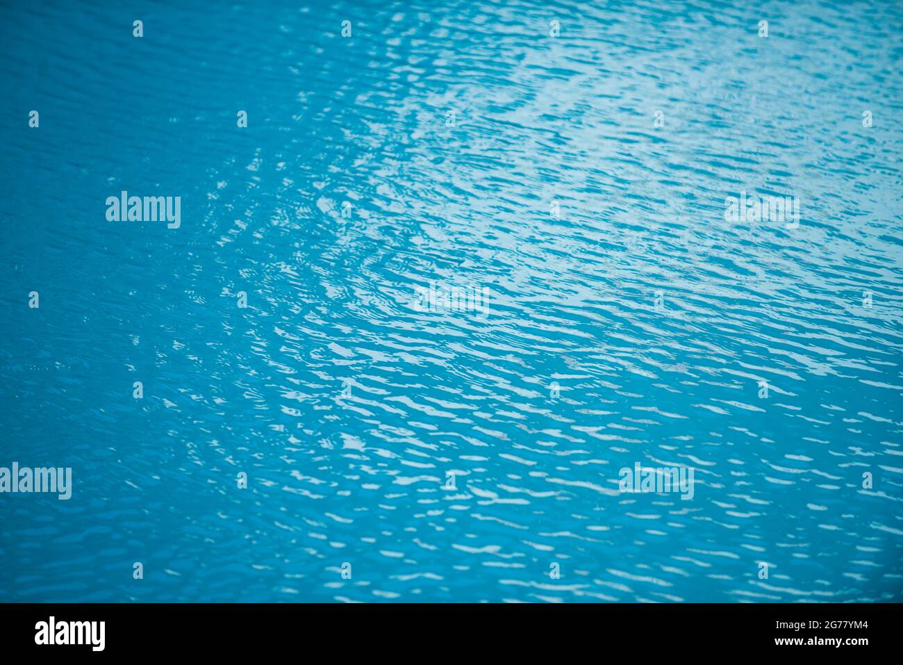 Abstract ripple wave and clear turquoise water surface in swimming pool ...