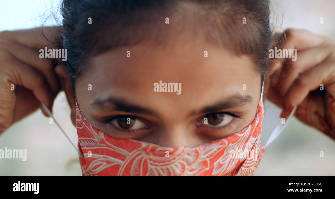 Closeup shot of an Indian girl wearing a mask- new normal concept Stock Photo - Alamy