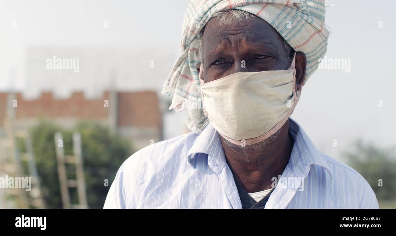 Old Indian man wearing a face mask- new normal concept Stock Photo - Alamy