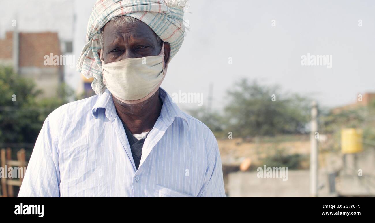 Old Indian man wearing a face mask- new normal concept Stock Photo - Alamy