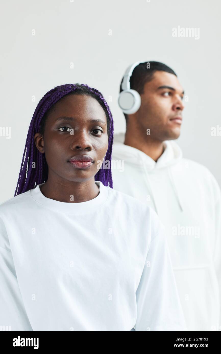 Vertical graphic portrait of young mixed race couple wearing white ...