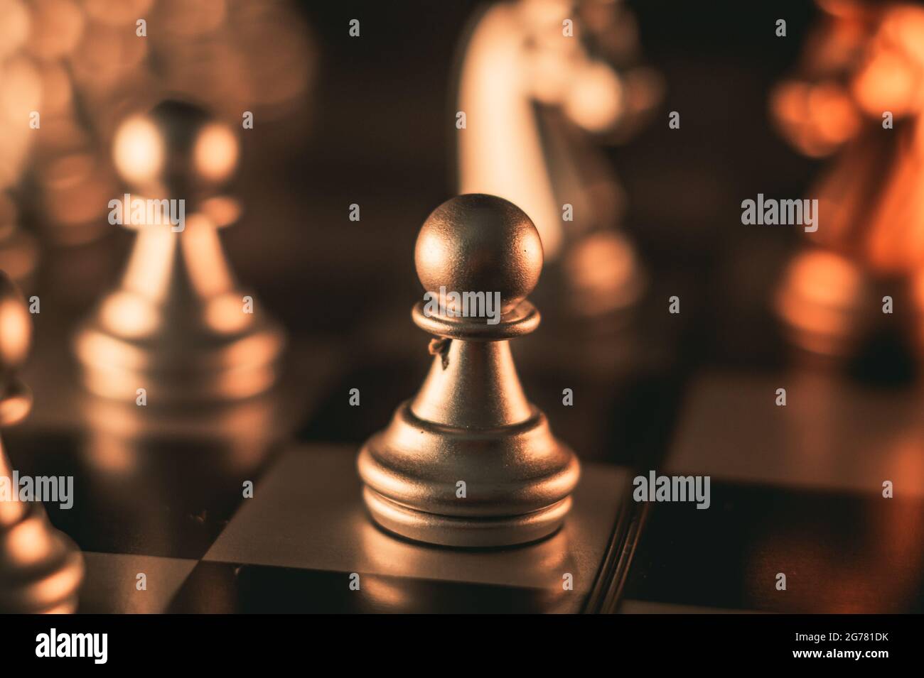 Black pawn on a chess board Stock Photo - Alamy