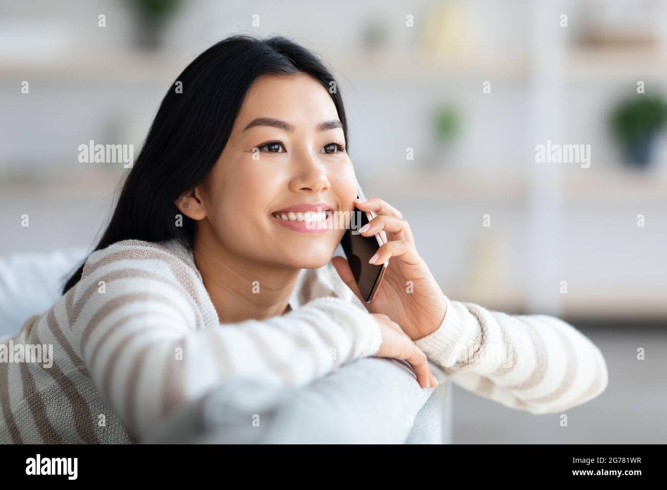Asian woman talking hi-res stock photography and images - Alamy