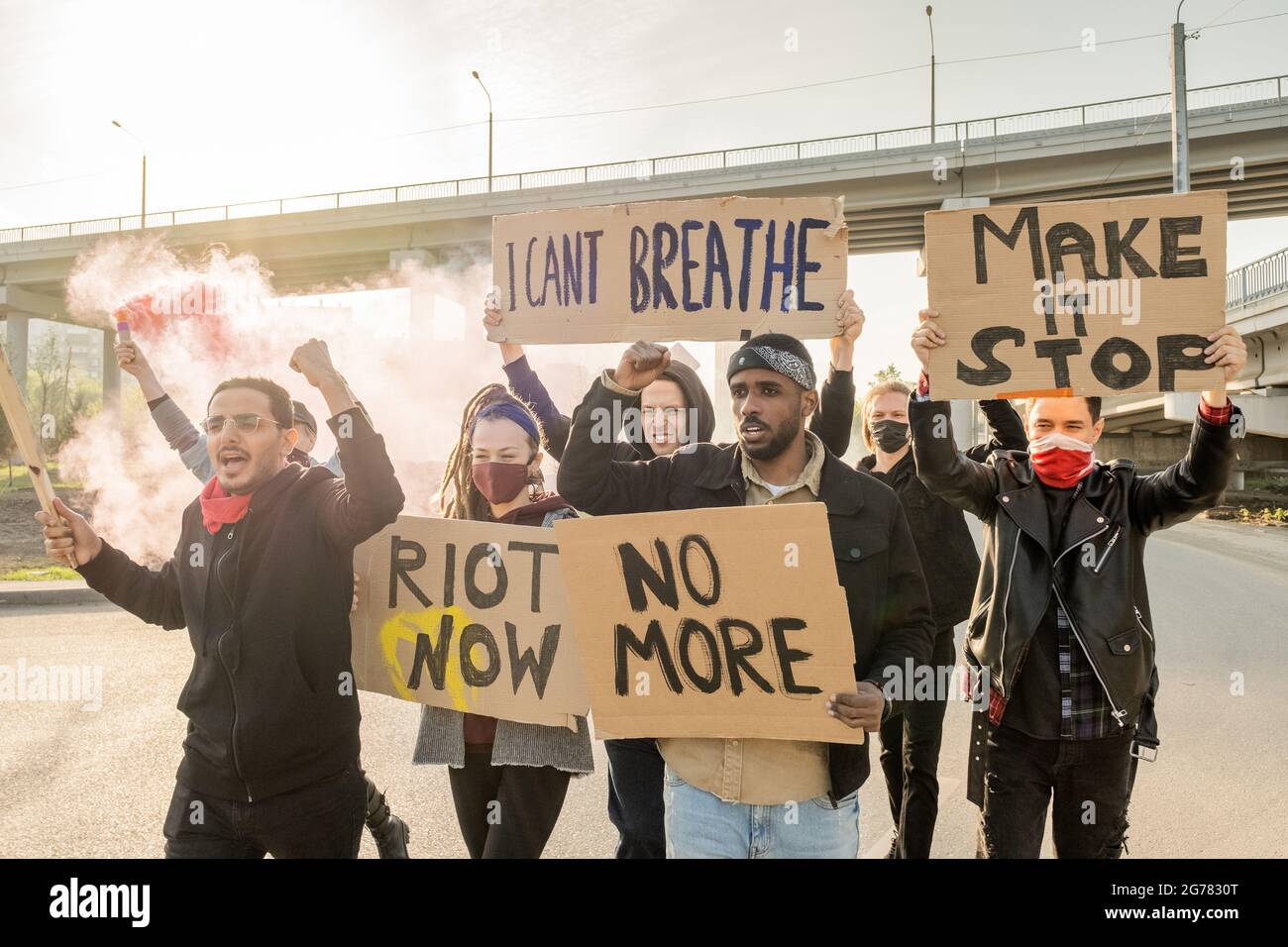 Standing looking at camera smiling holding placard text social issues ...
