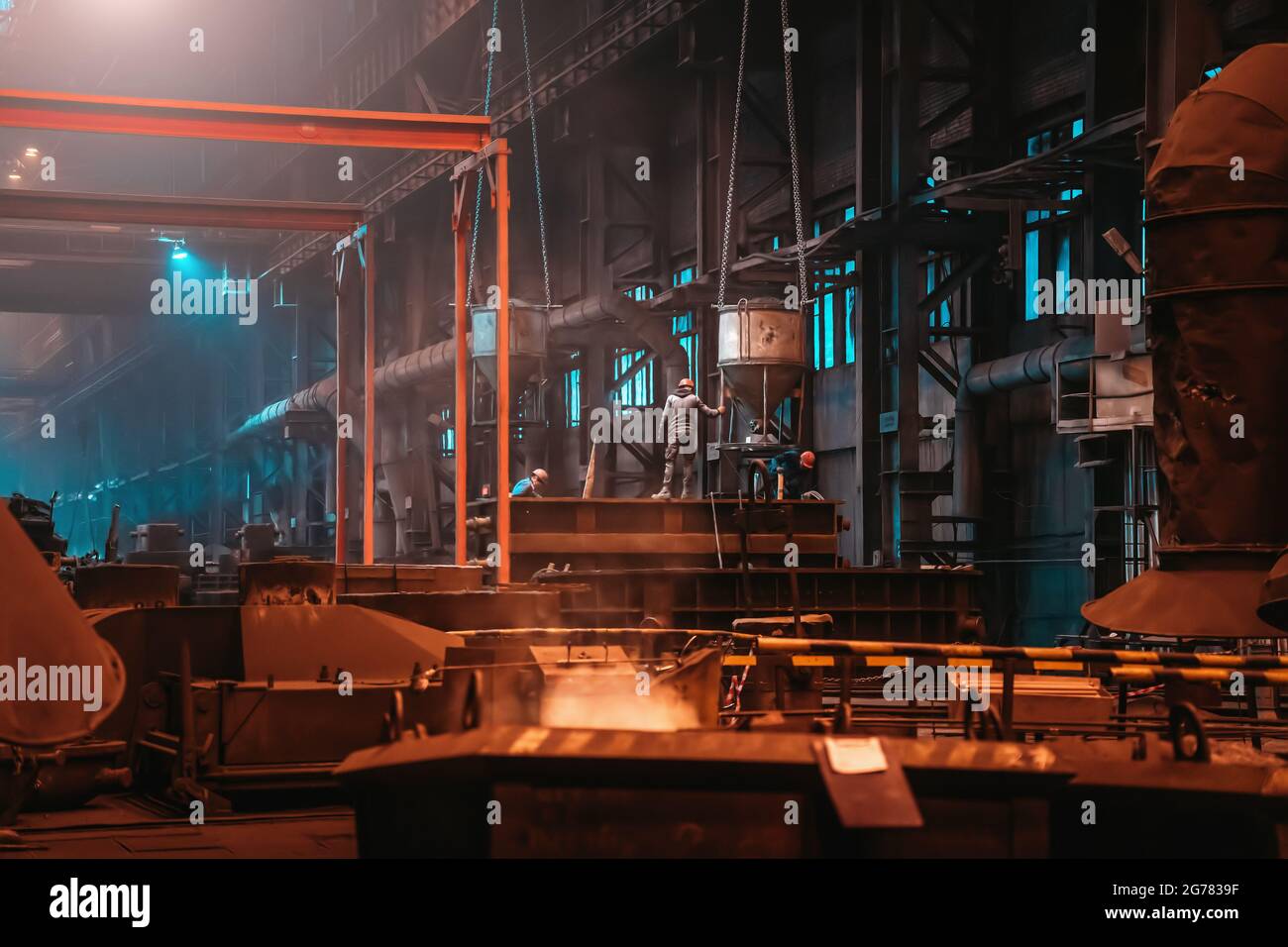 Foundry workshop. Metallurgical plant with unrecognizable workers ...