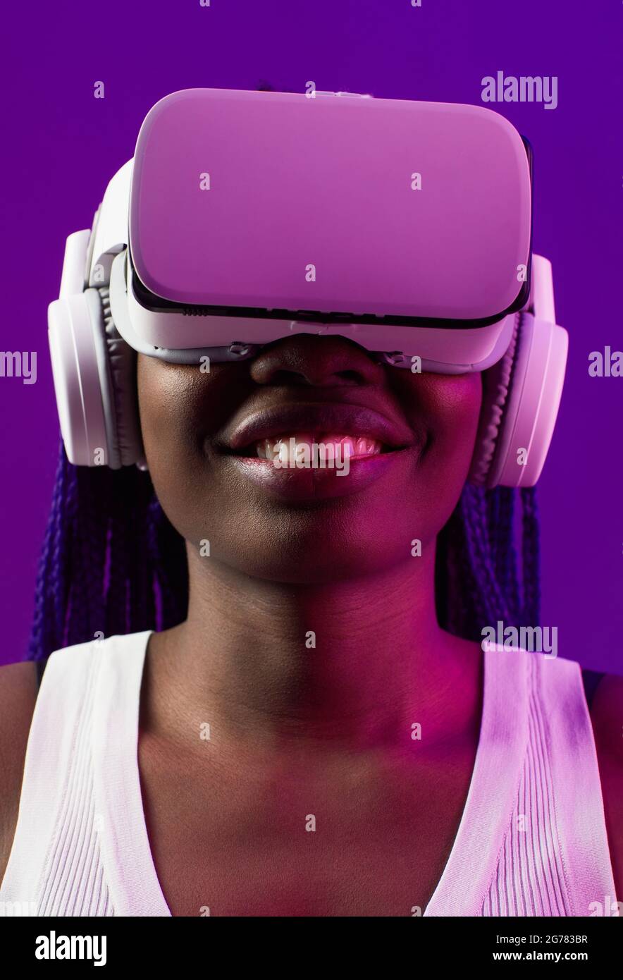 Futuristic closeup portrait of young African-American woman wearing VR ...