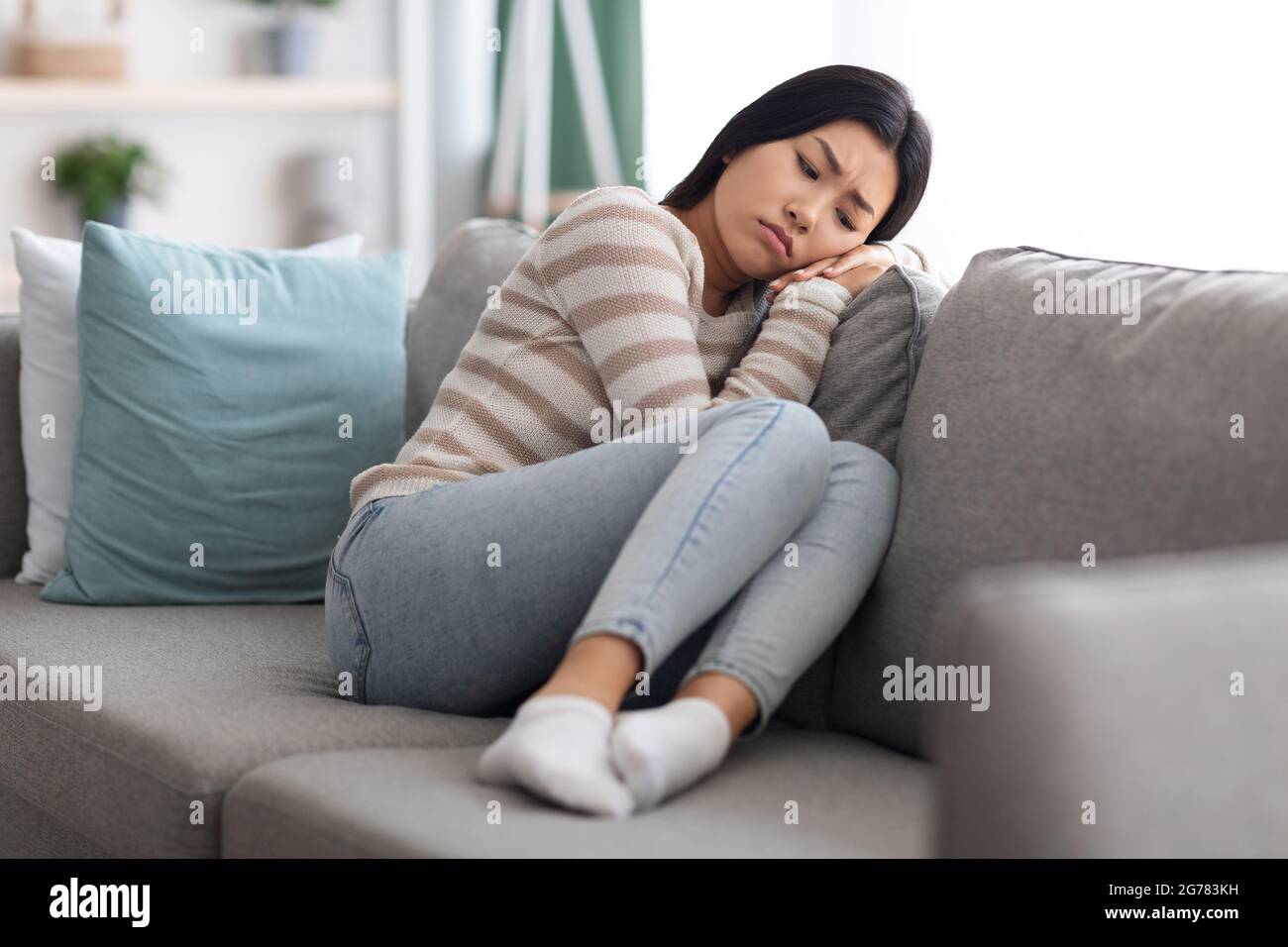 Sofa home person sad hi-res stock photography and images - Alamy