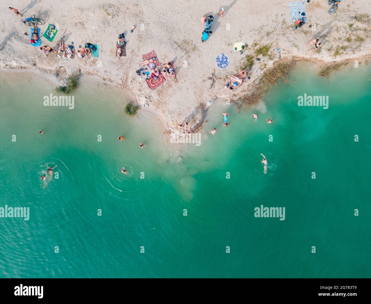 aerial view of people swimming in blue azure water sunbathing resting ...