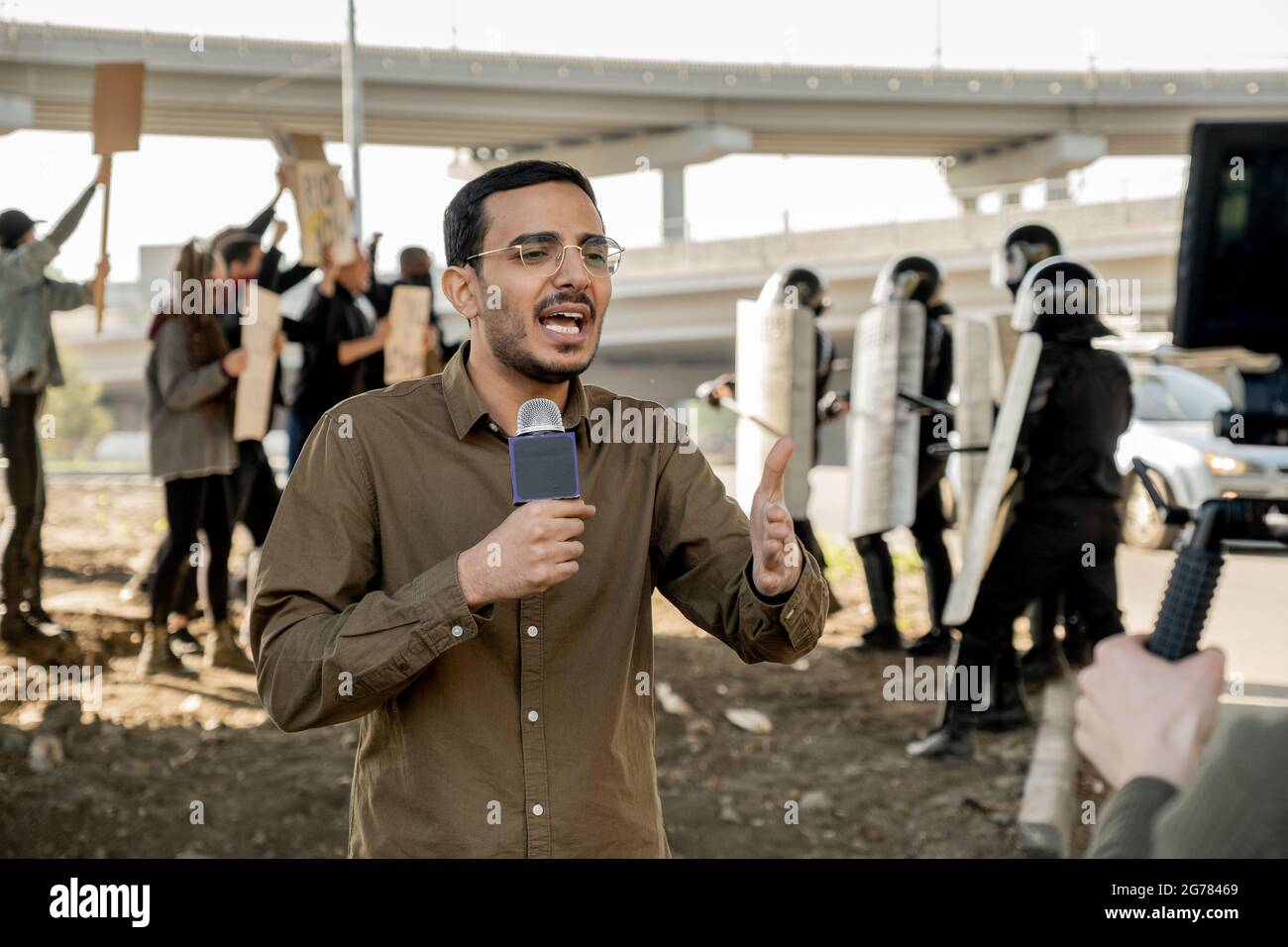 Standing microphone gesturing communication smiling hi-res stock ...