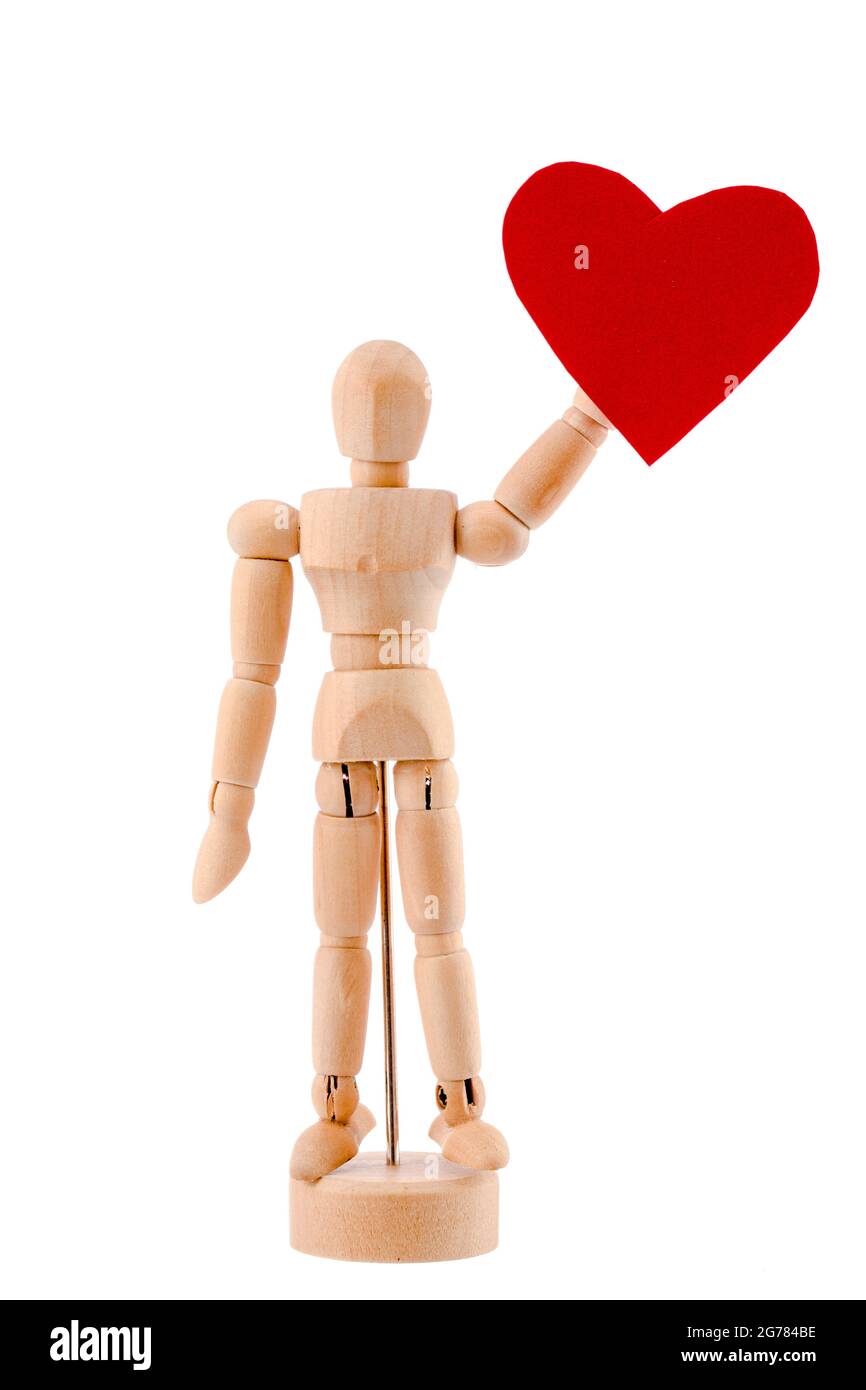 Wooden man toy statue and heart isolated on white background. Valentine ...