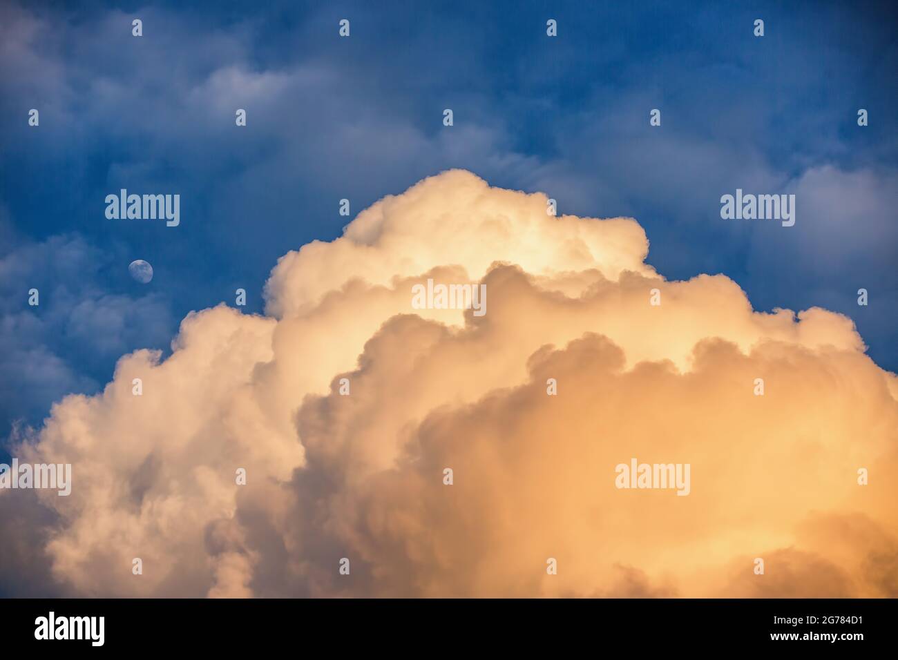 Sunset sky with moon and clouds Stock Photo - Alamy