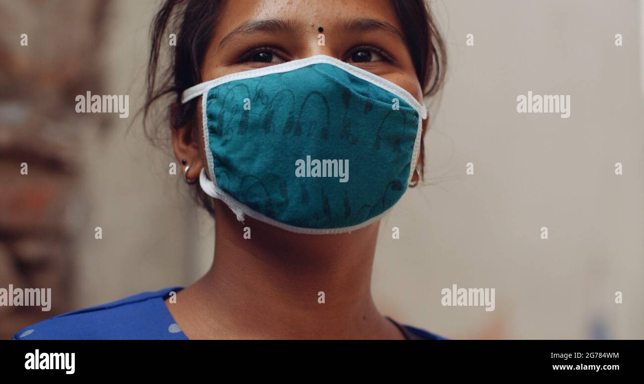 Shallow focus of an Indian girl wearing a face mask- new normal concept Stock Photo - Alamy