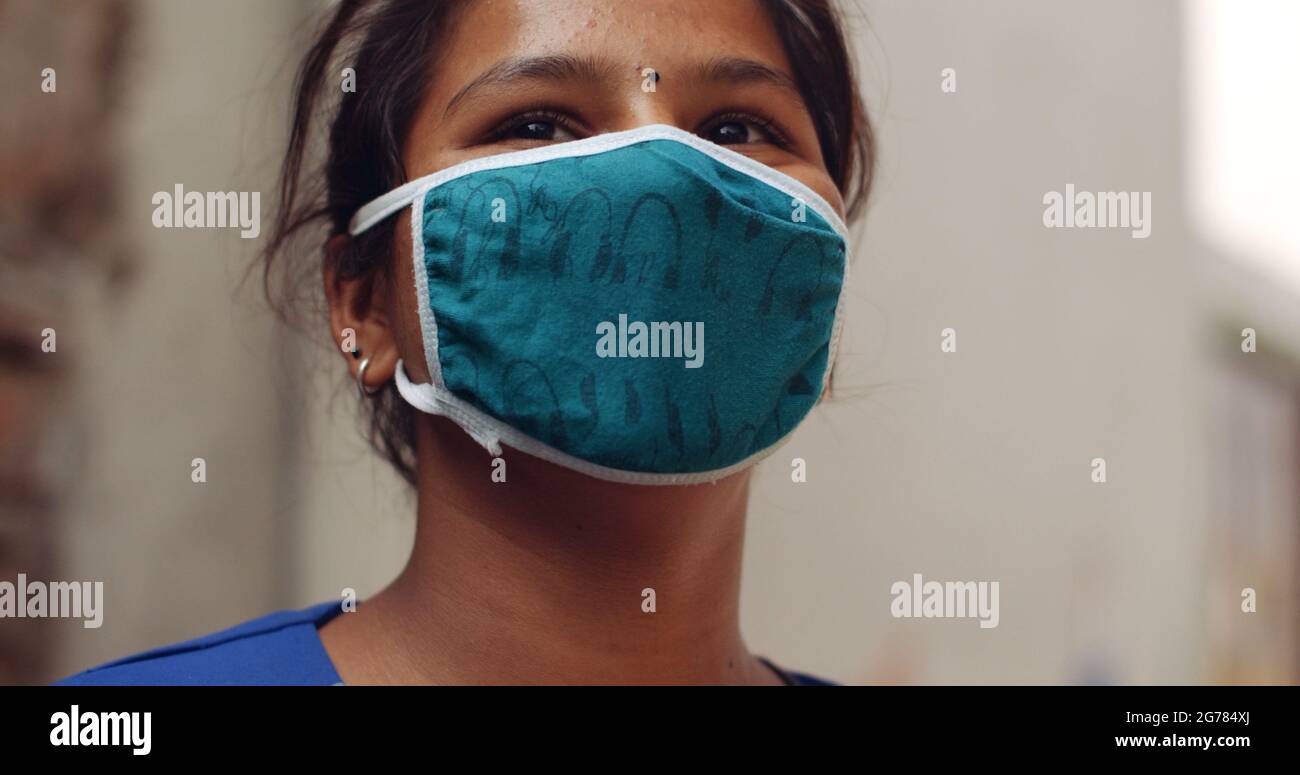 Closeup shot of an Indian girl wearing a mask- new normal concept Stock Photo - Alamy